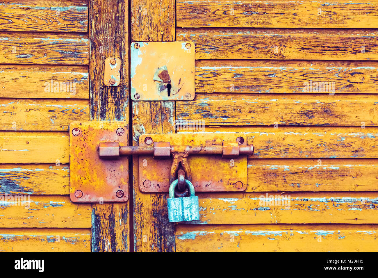 Old background texture with a rusty lock on the door Stock Photo - Alamy