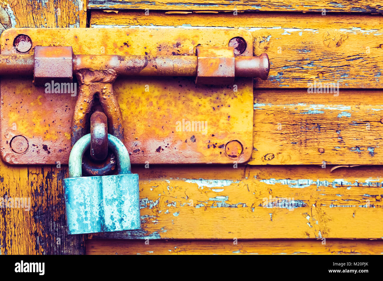 Old background texture with a rusty lock on the door Stock Photo - Alamy