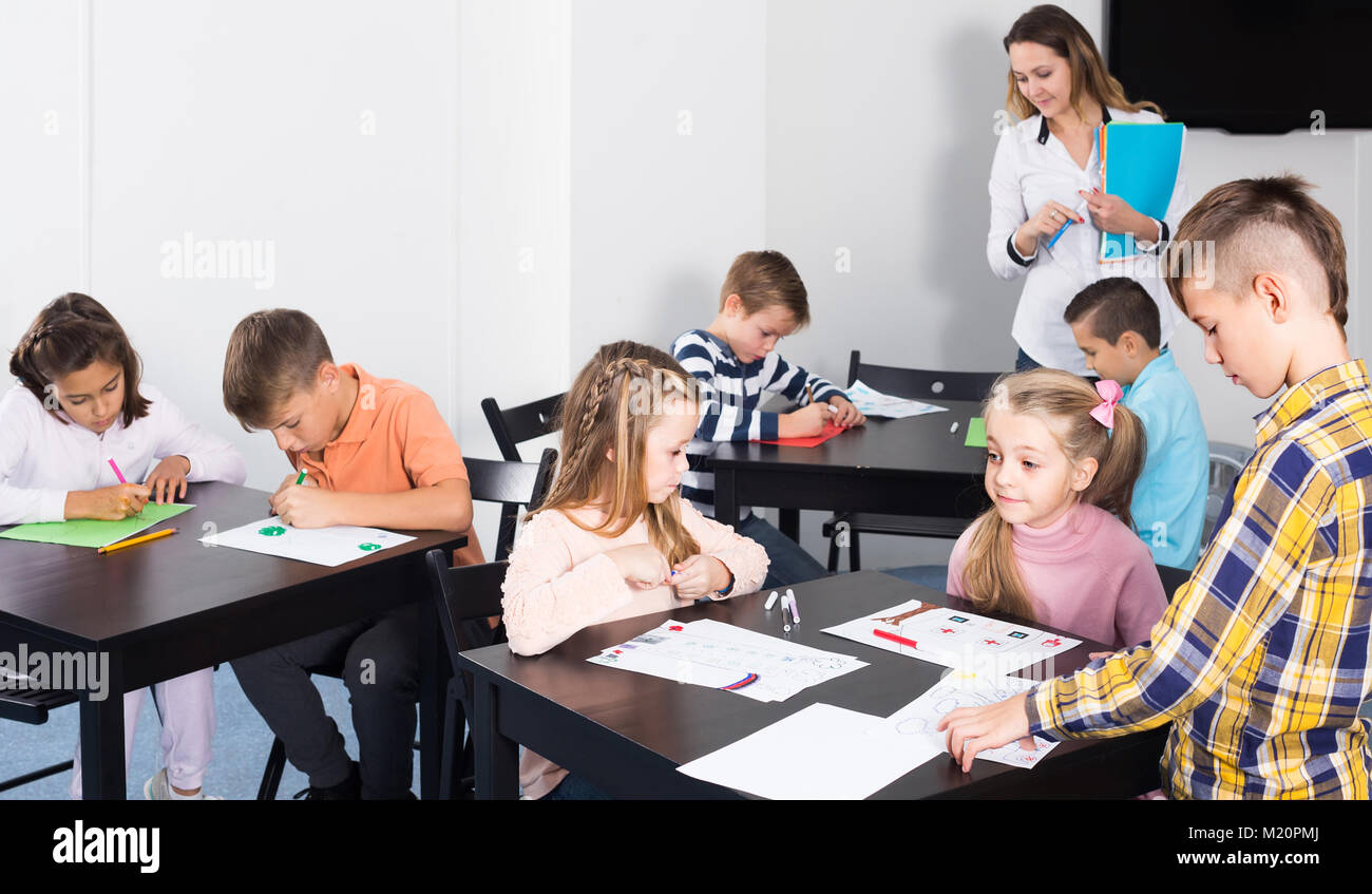 smiling children of elementary age having class of art Stock Photo - Alamy