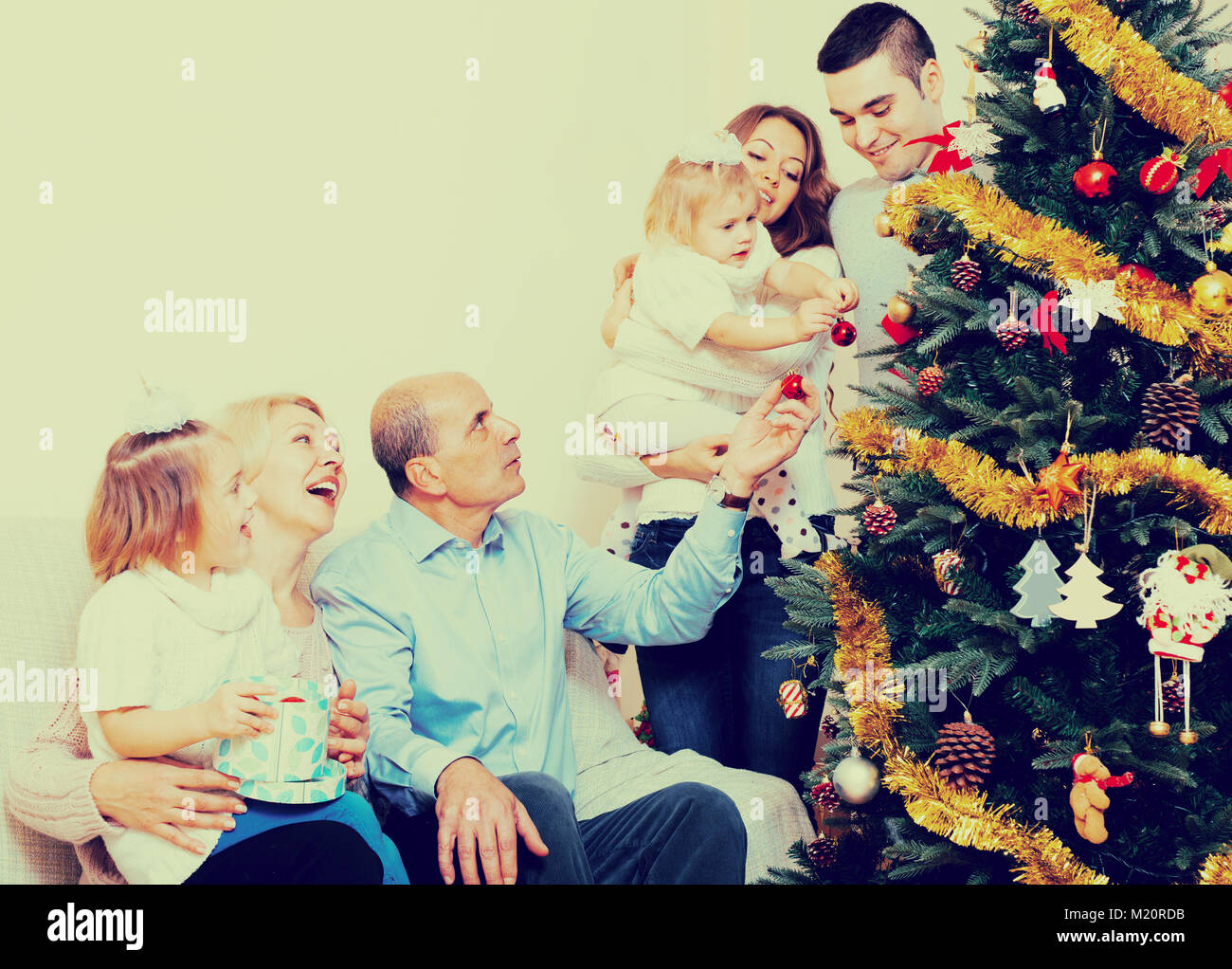 big smiling family with decorated Christmas tree Stock Photo - Alamy