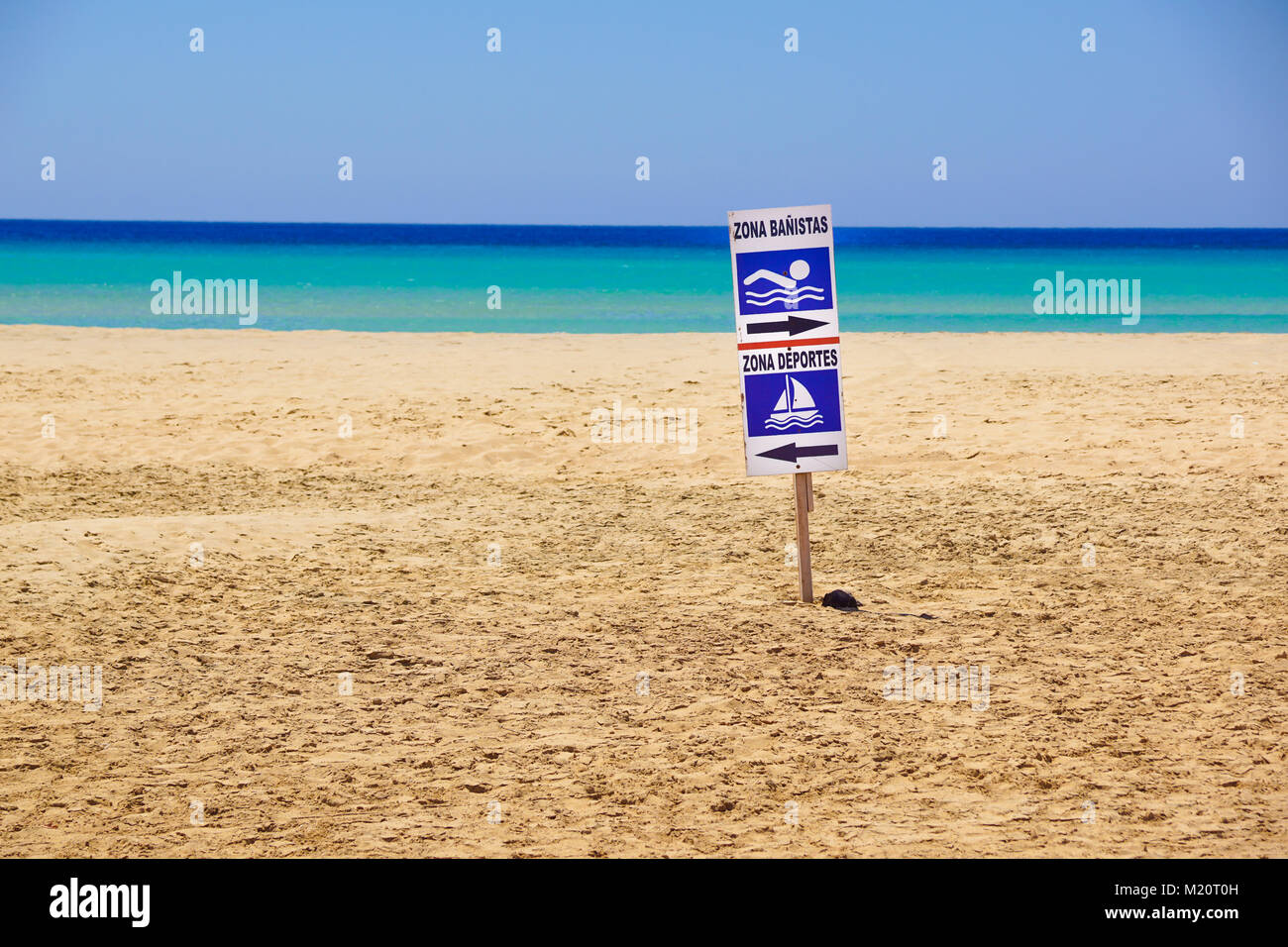 sign of bathing area on the beach for the safety of bathers compared to ...