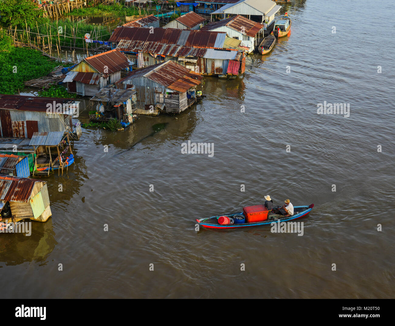 Chau Doc, Vietnam - Sep 3, 2017. A wooden boat with floating houses in ...