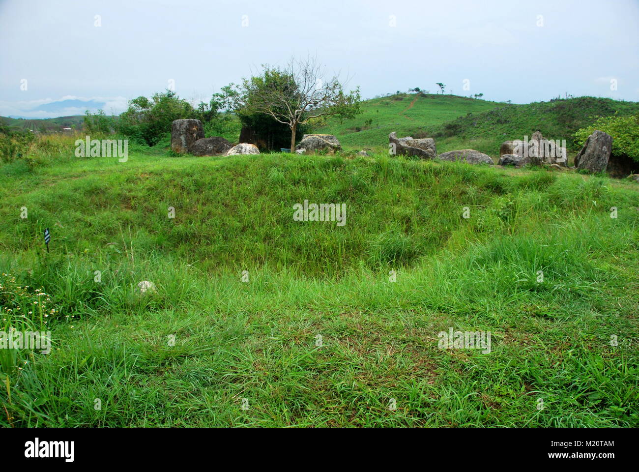 Bomb craters from the Vietnam War surround giant megalithic stone urns ...