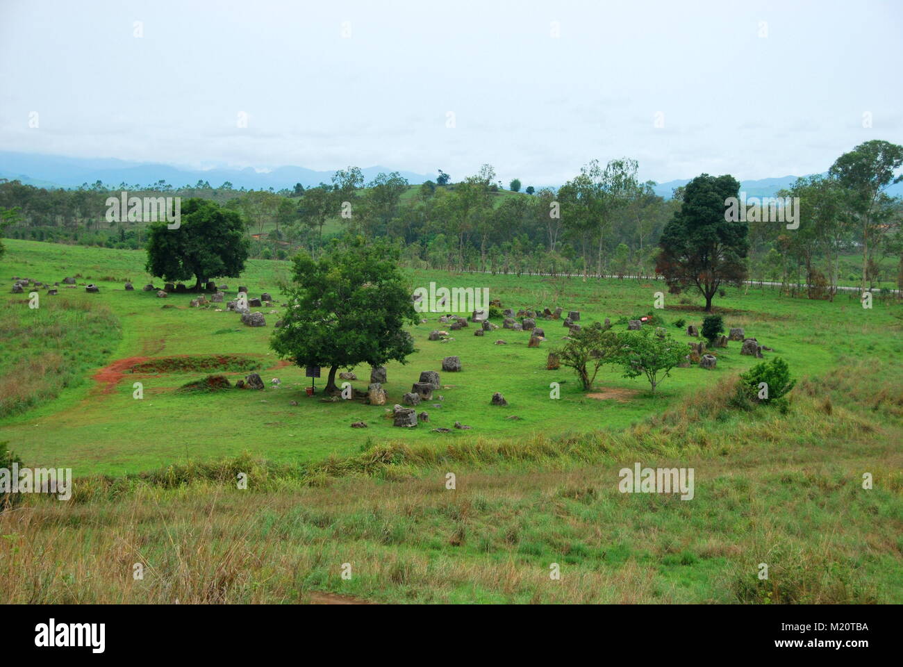 Bomb craters from the Vietnam War surround giant megalithic stone urns ...