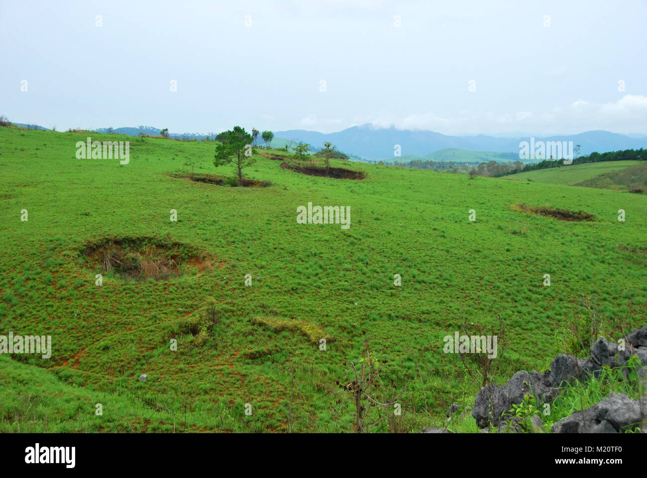 Bomb craters from the Vietnam War surround giant megalithic stone urns ...