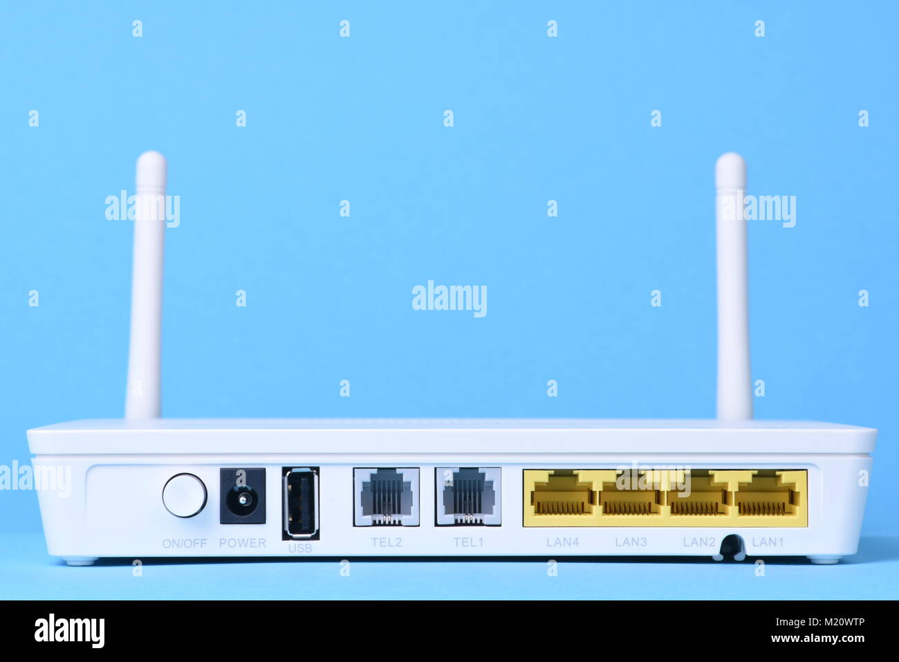 Wireless router network with cable on blue background Stock Photo - Alamy