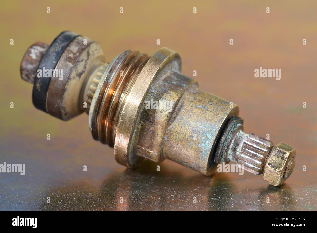 Old brass tap valve close-up on metal surface Stock Photo - Alamy