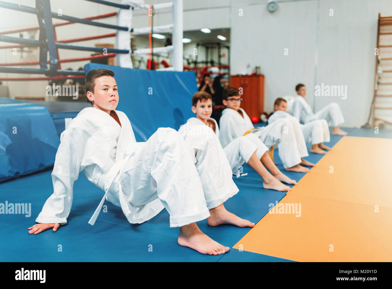 Children judo, kids in kimono practice martial art in hall. Little boys ...