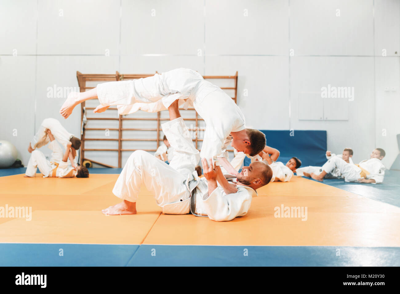 Kid judo, young fighters on training. Little boys in kimono practice ...
