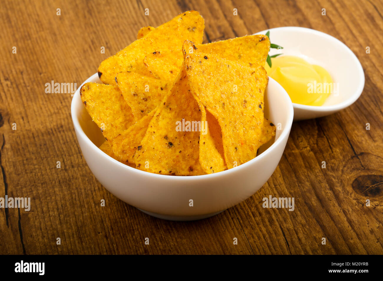 Nachos with cheese sauce Stock Photo - Alamy