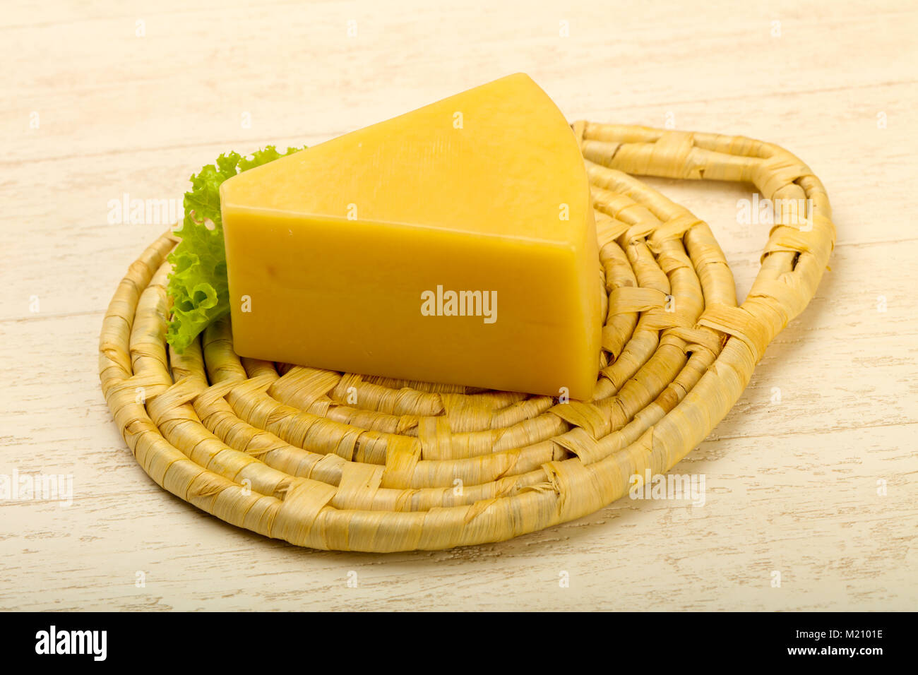 Parmesan cheese triangle Stock Photo - Alamy