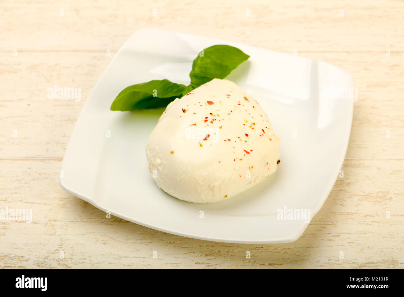 Mozzarella cheese with basil leaves Stock Photo - Alamy