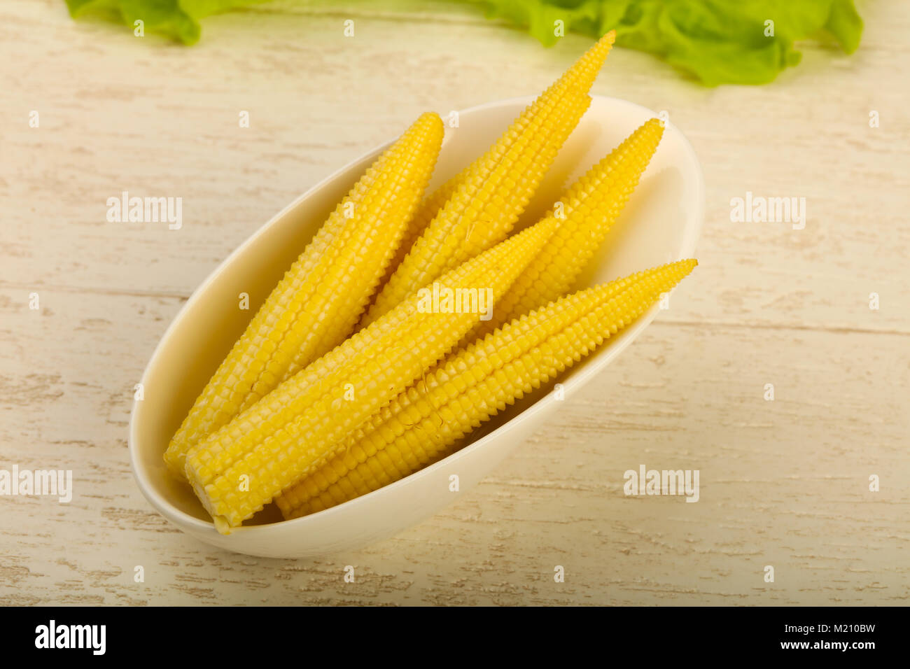 Young raw baby corn Stock Photo - Alamy