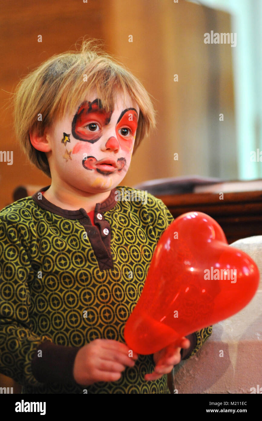 A child wearing clown make-up during the 67th Annual Grimaldi Clown ...