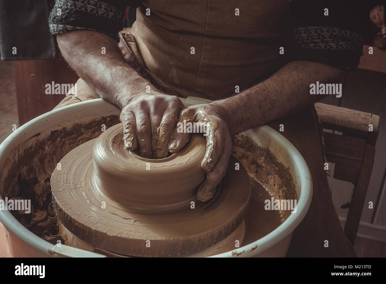 elderly man making pot using pottery wheel in studio. Close-up Stock ...