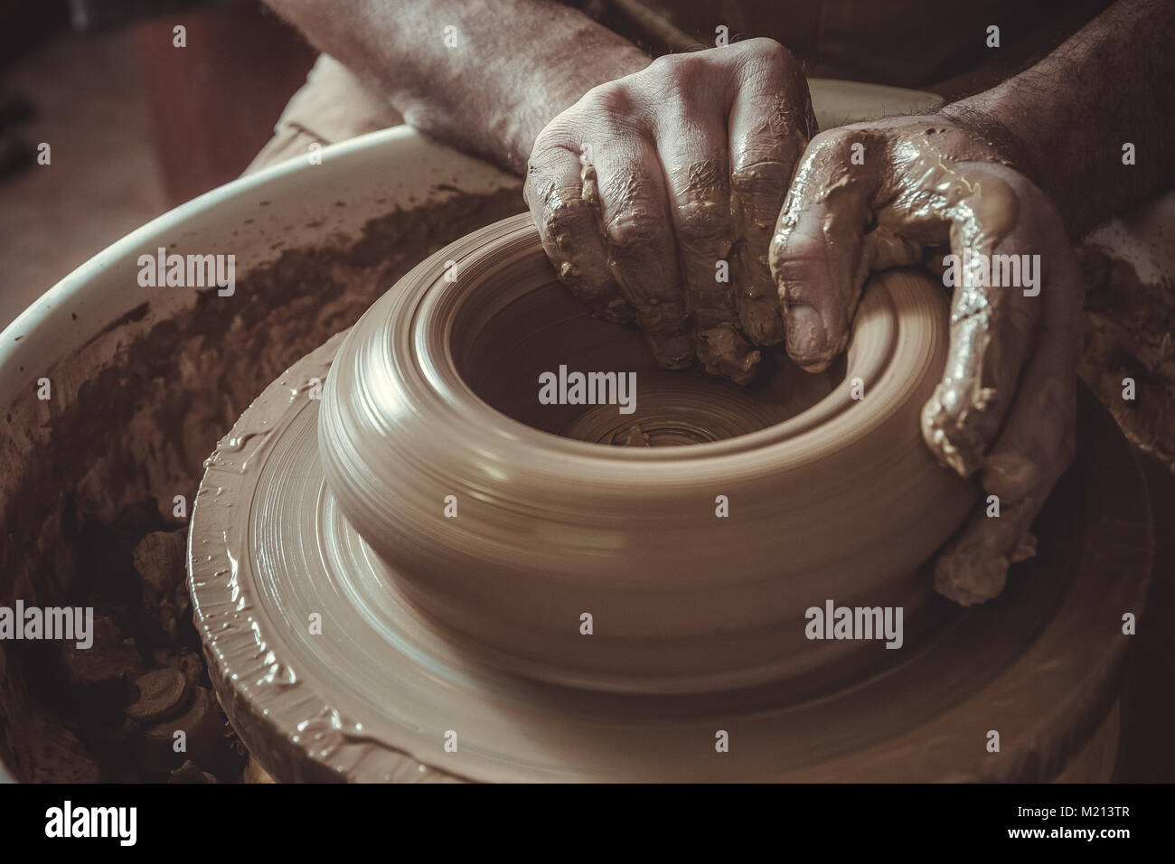 elderly man making pot using pottery wheel in studio. Close-up Stock ...