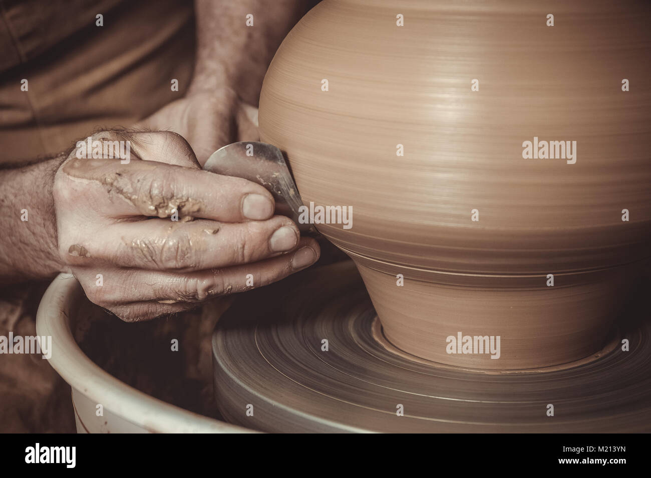 elderly man making pot using pottery wheel in studio Stock Photo - Alamy