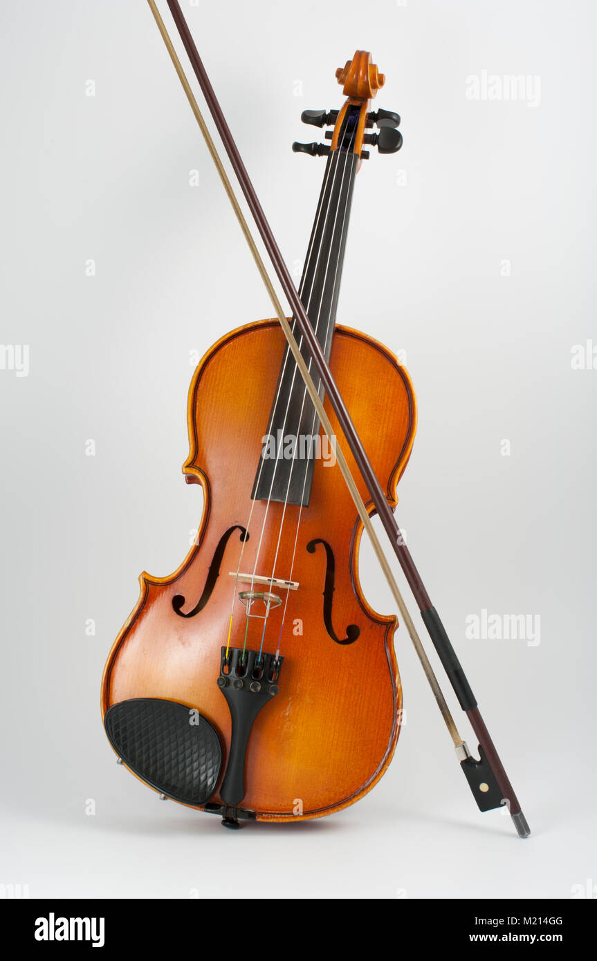 Violin with bow upright and isolated on white background Stock Photo ...