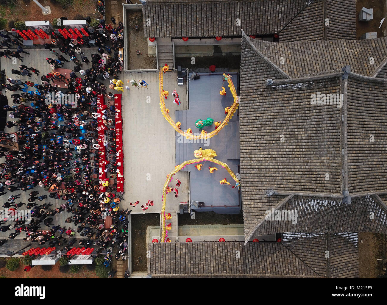Shengzhou, China, 3rd Feb, 2018. Villagers view dragon and lion dance ...