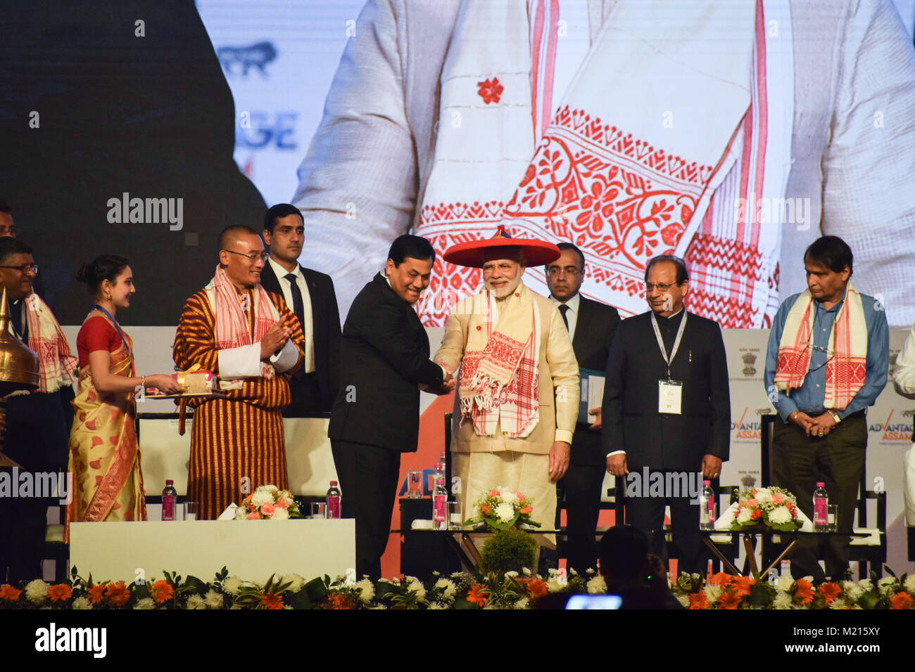 Prime Minister of India Narendra Modi being felicitated by Assam Chief ...