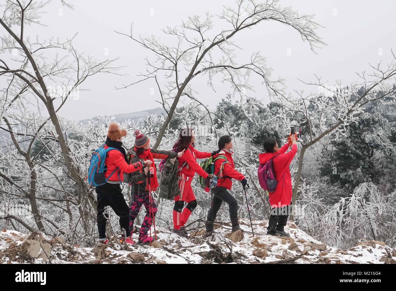 Guiyang, China's Guizhou Province. 3rd Feb, 2018. Tourists enjoy frost ...