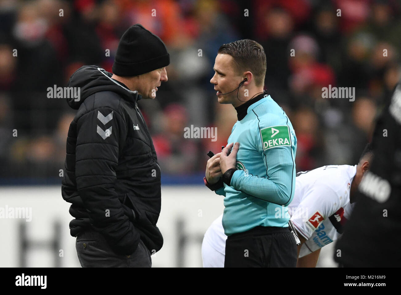 Freiburg coach Christian Streich (L) in discussion with referee Robert ...