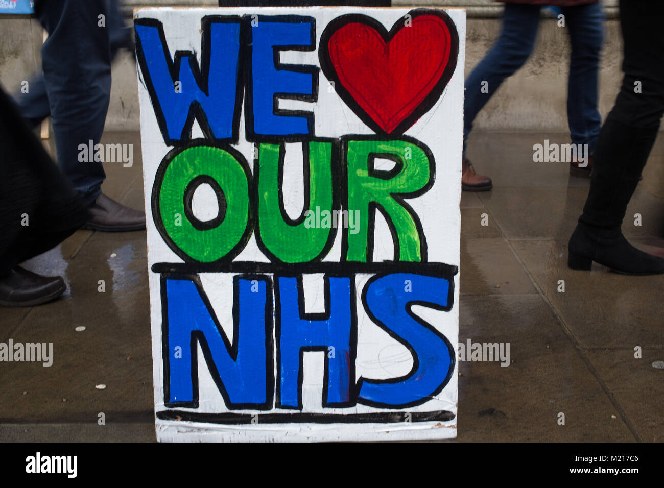 London UK 3rd feb 2017 People walk past a placard "we Love our NHS ...
