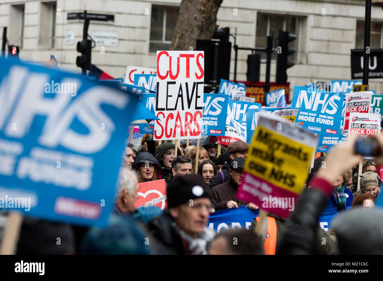 Protesters and campaigners on a save the NHS march in central London ...