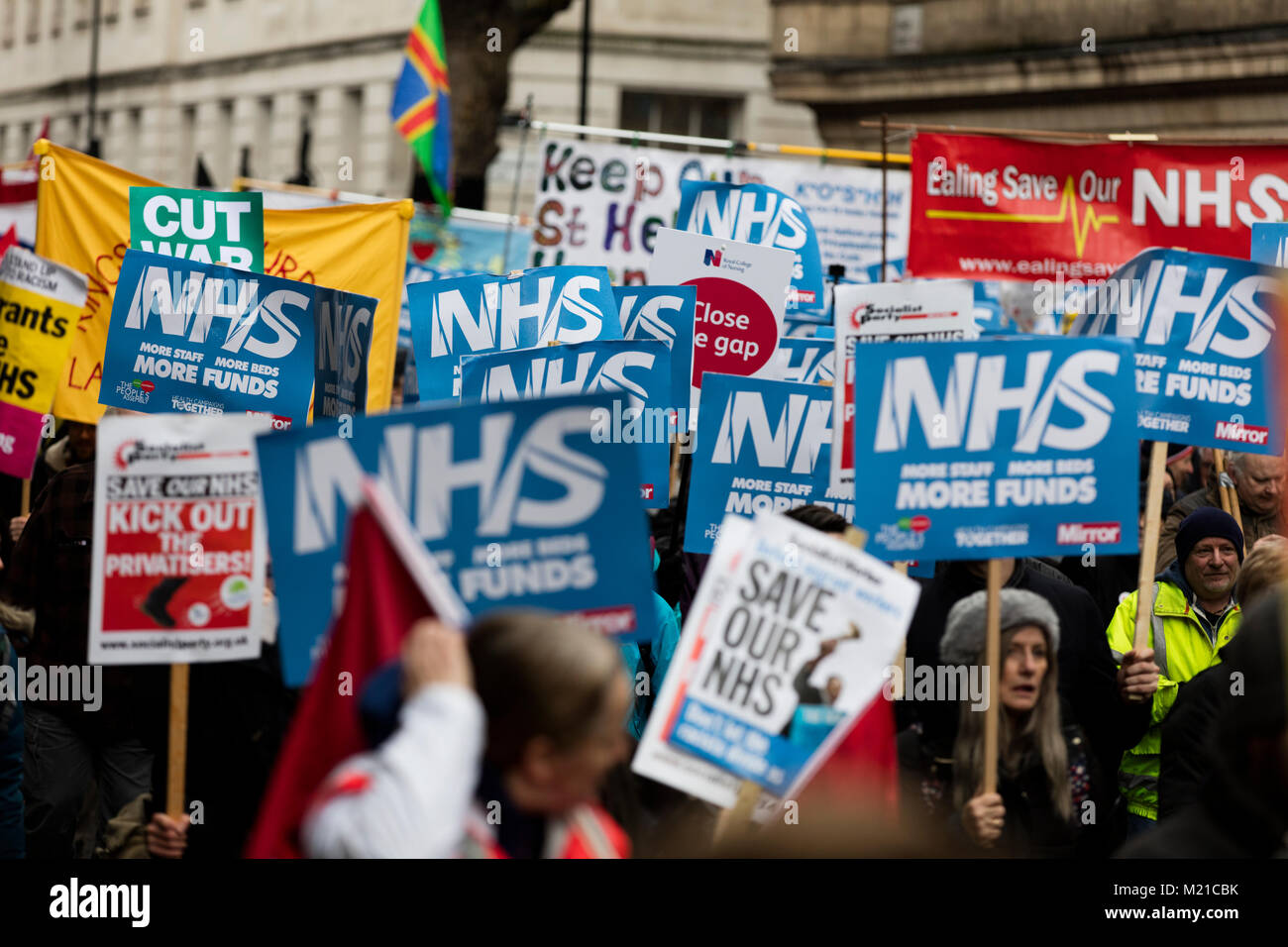 Protesters and campaigners on a save the NHS march in central London ...