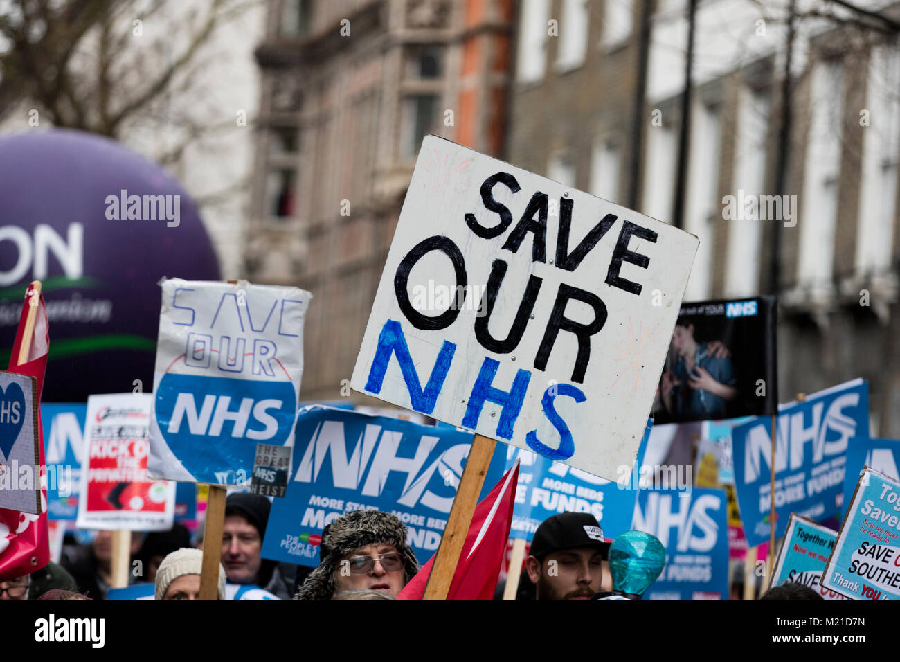 Protesters and campaigners on a save the NHS march in central London ...