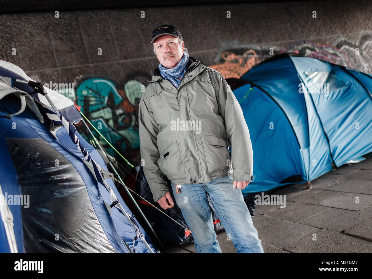The formerly homeless Joerg Petersen, standing at a homeless camp under ...