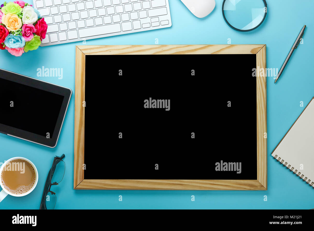 top view of chalk board, magnifying glass, business object and ...