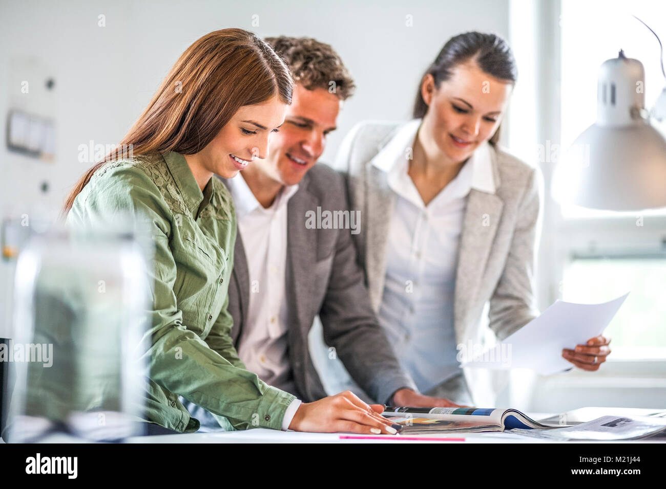 Business people working at desk in office Stock Photo - Alamy