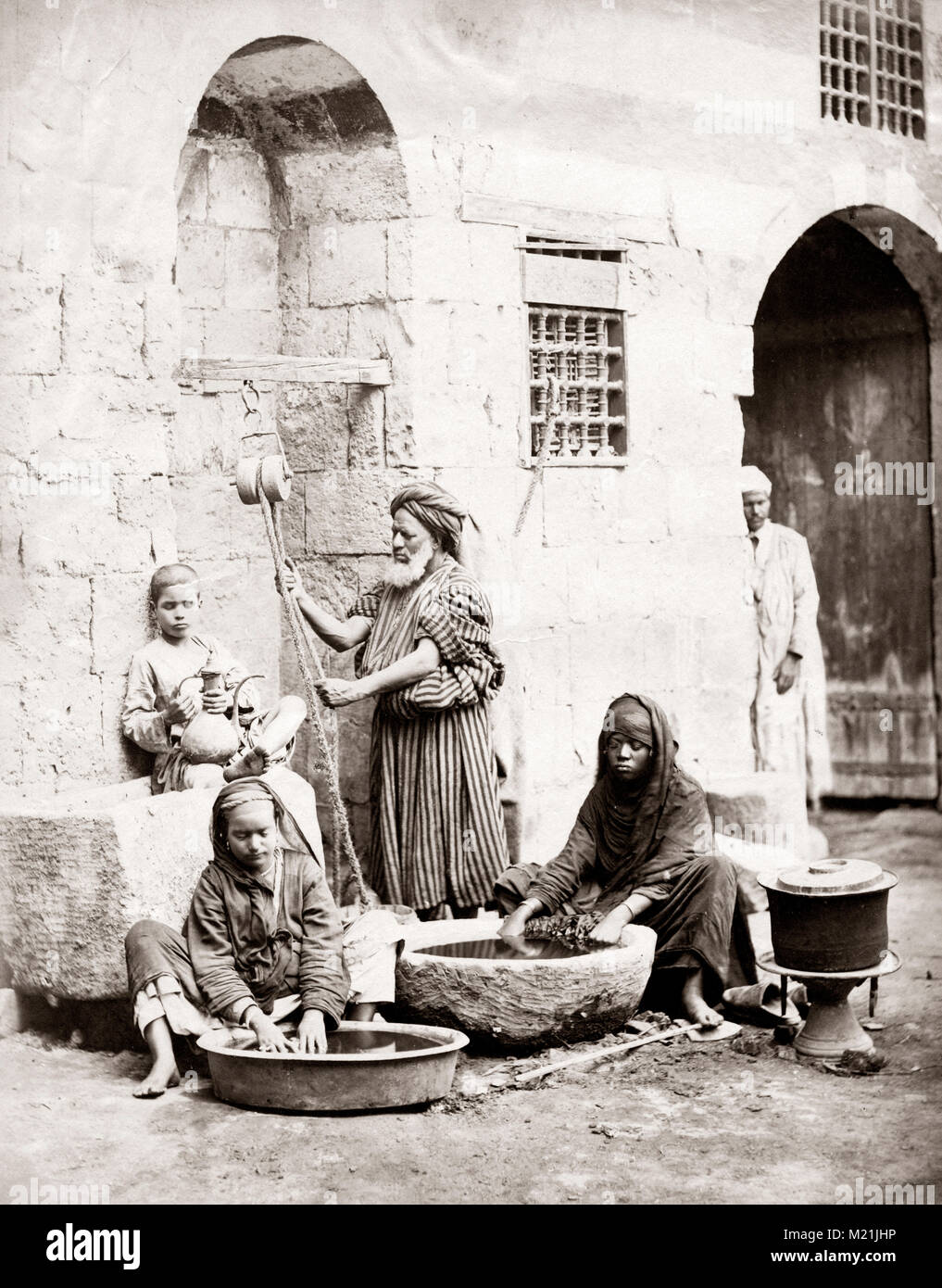 c.1880s Egypt Cairo - women washing with water from a well Stock Photo ...