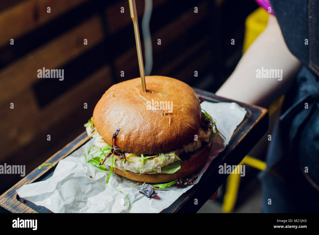 Fresh burger cooked at barbecue outdoors in craft paper. Cookout ...