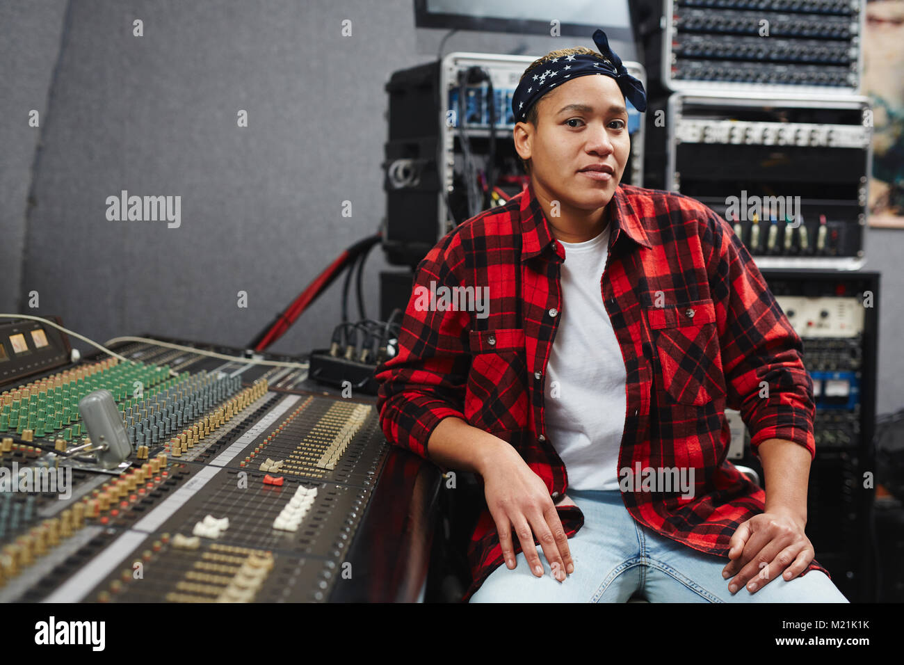 Sound operator by workplace Stock Photo - Alamy