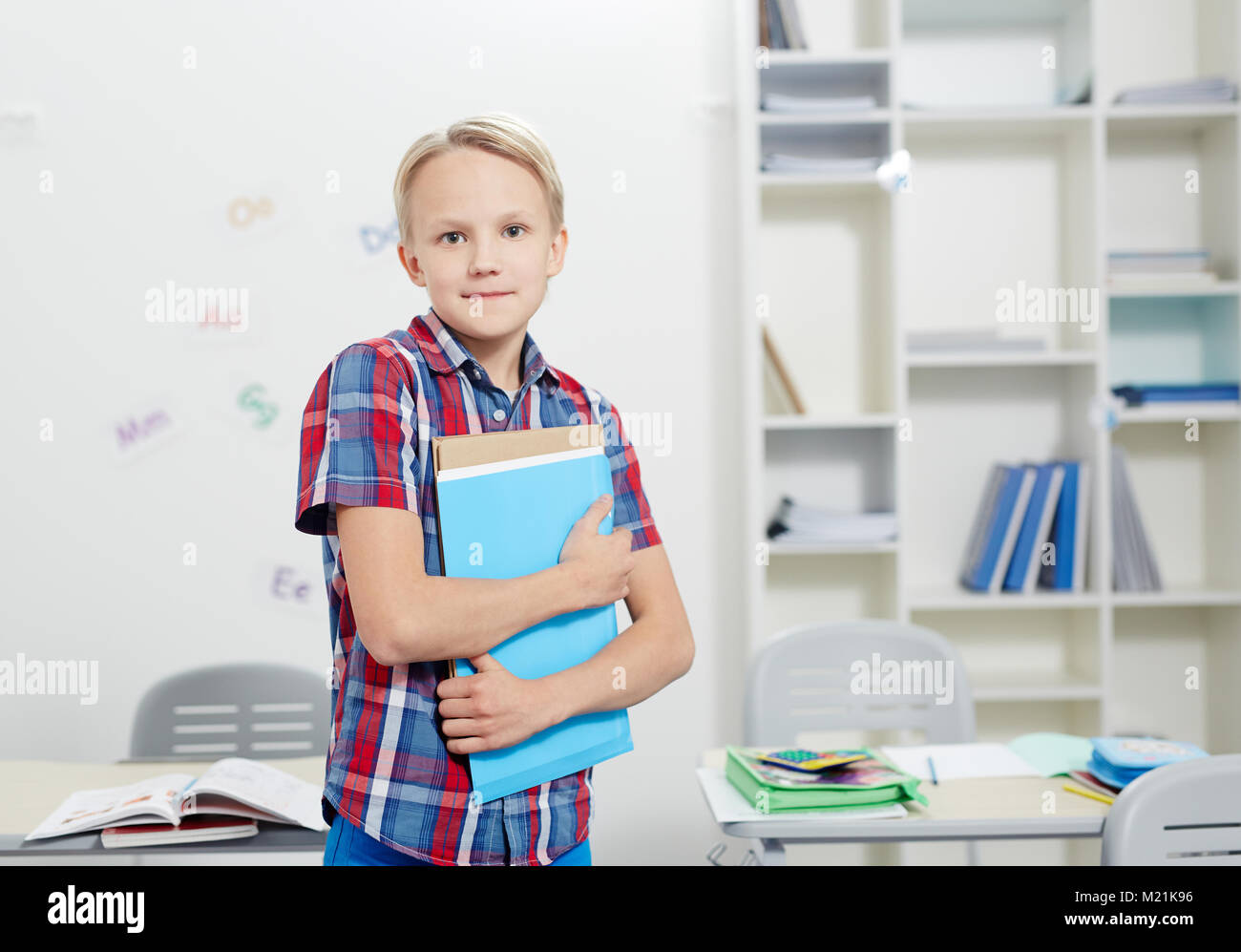 Boy in classroom Stock Photo - Alamy