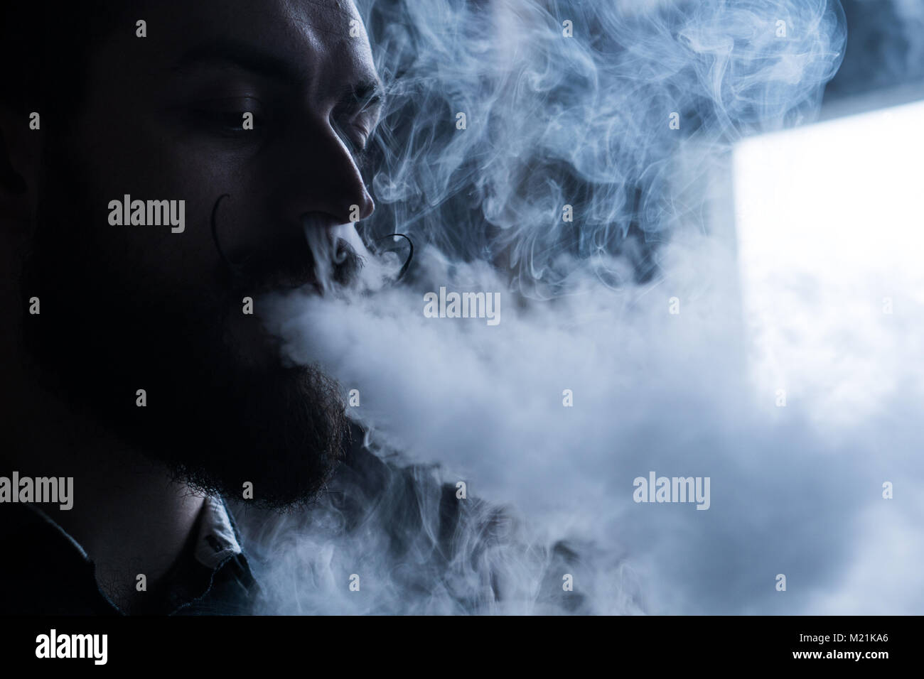 Man with Beard and Mustages Vaping an Electronic Cigarette. Vaper ...