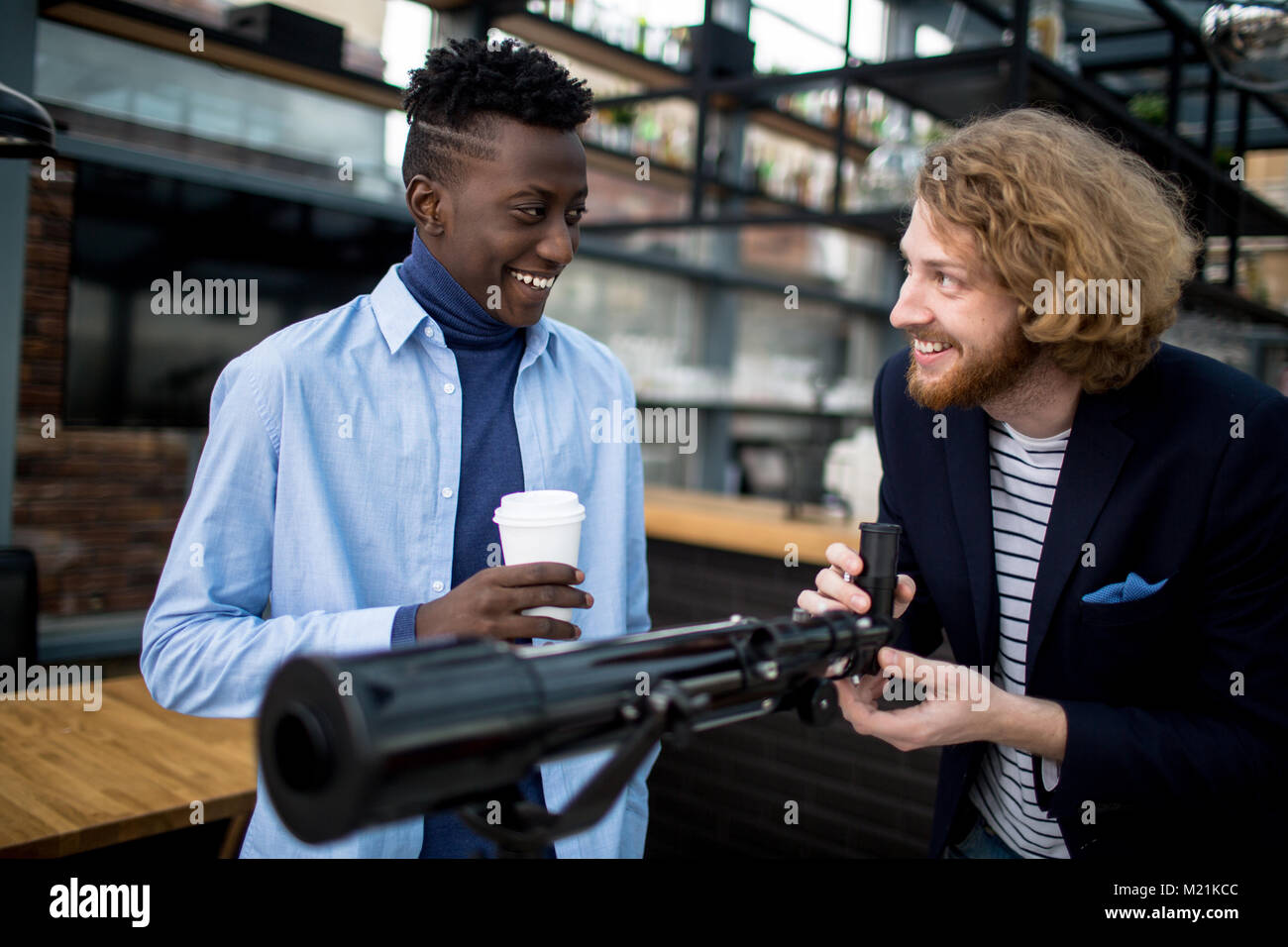 Men with telescope Stock Photo - Alamy