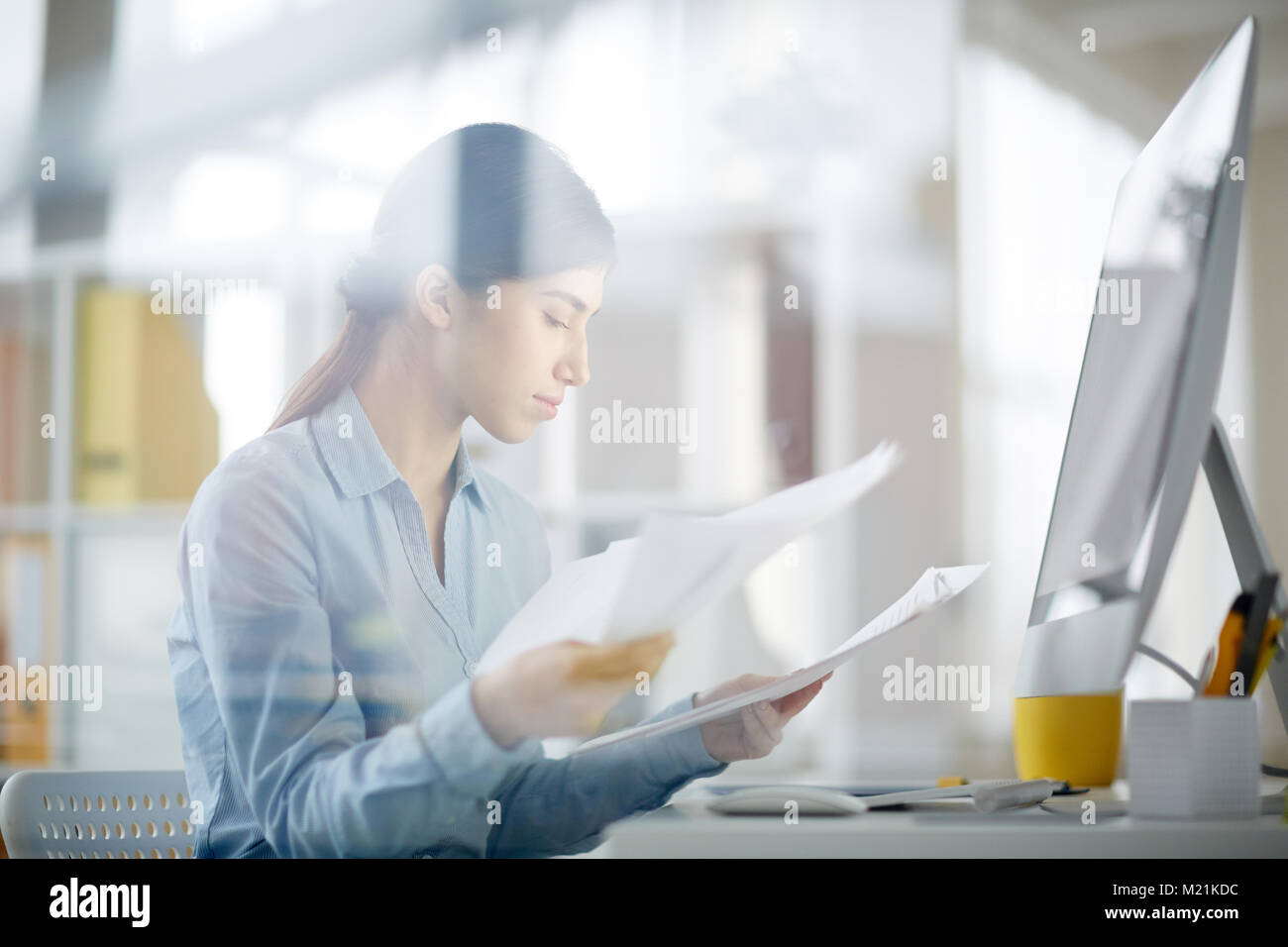 Woman working in office Stock Photo - Alamy