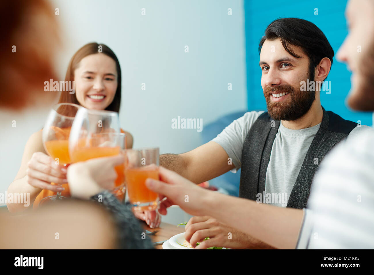 Friends with juice Stock Photo - Alamy