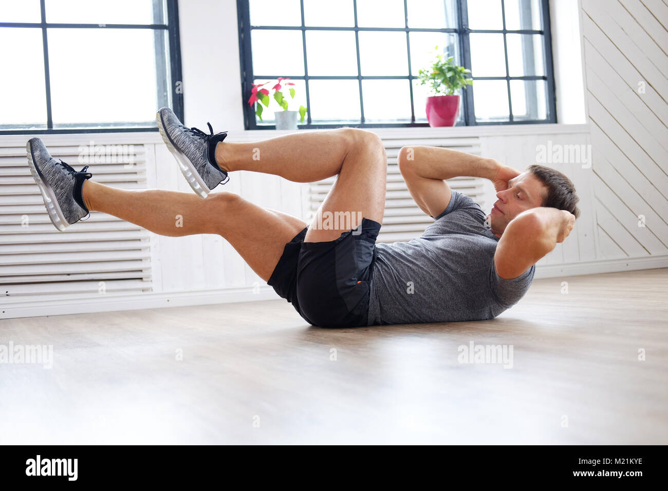 A man doing abs workouts Stock Photo - Alamy