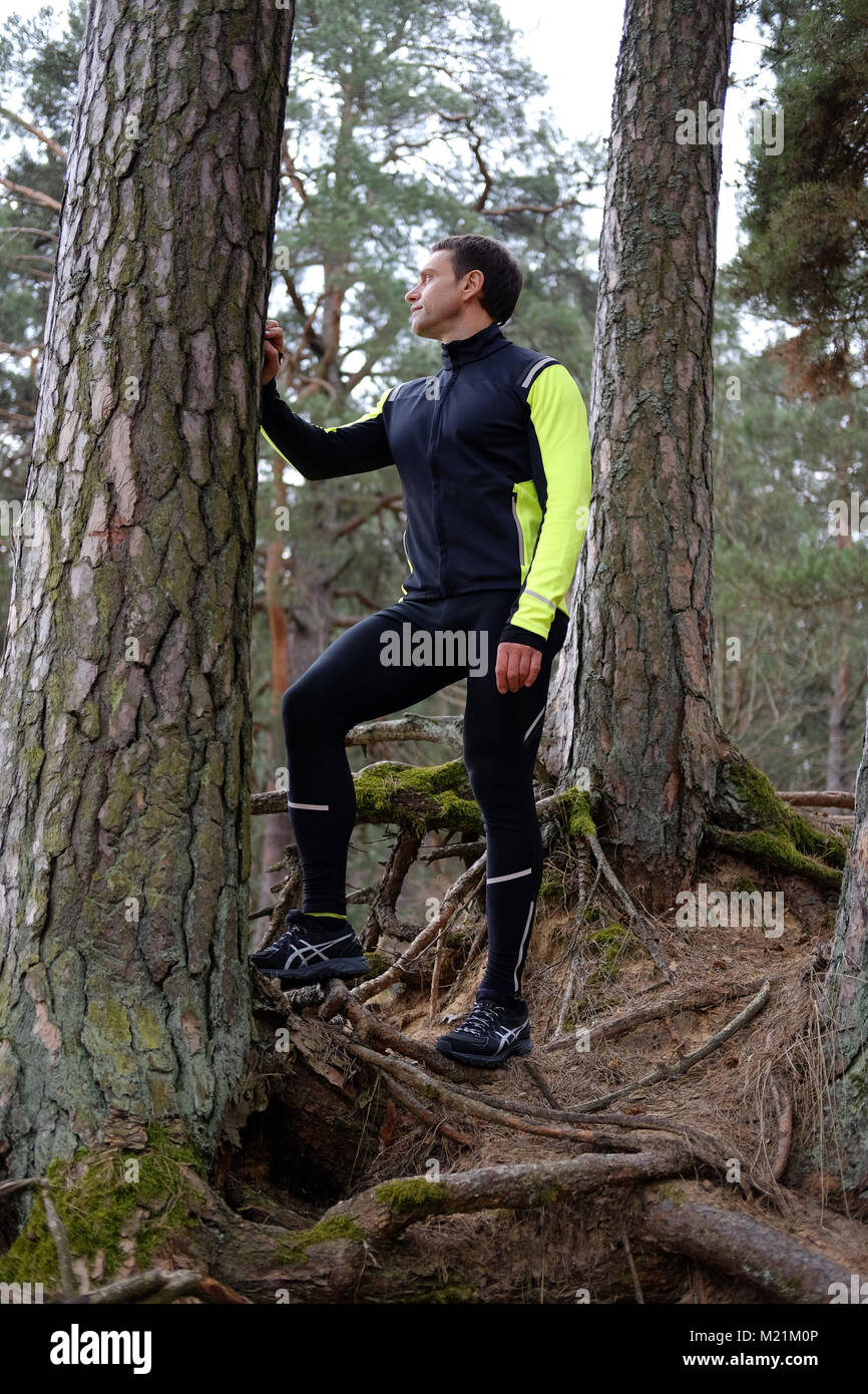 Sporty man in a forest Stock Photo - Alamy