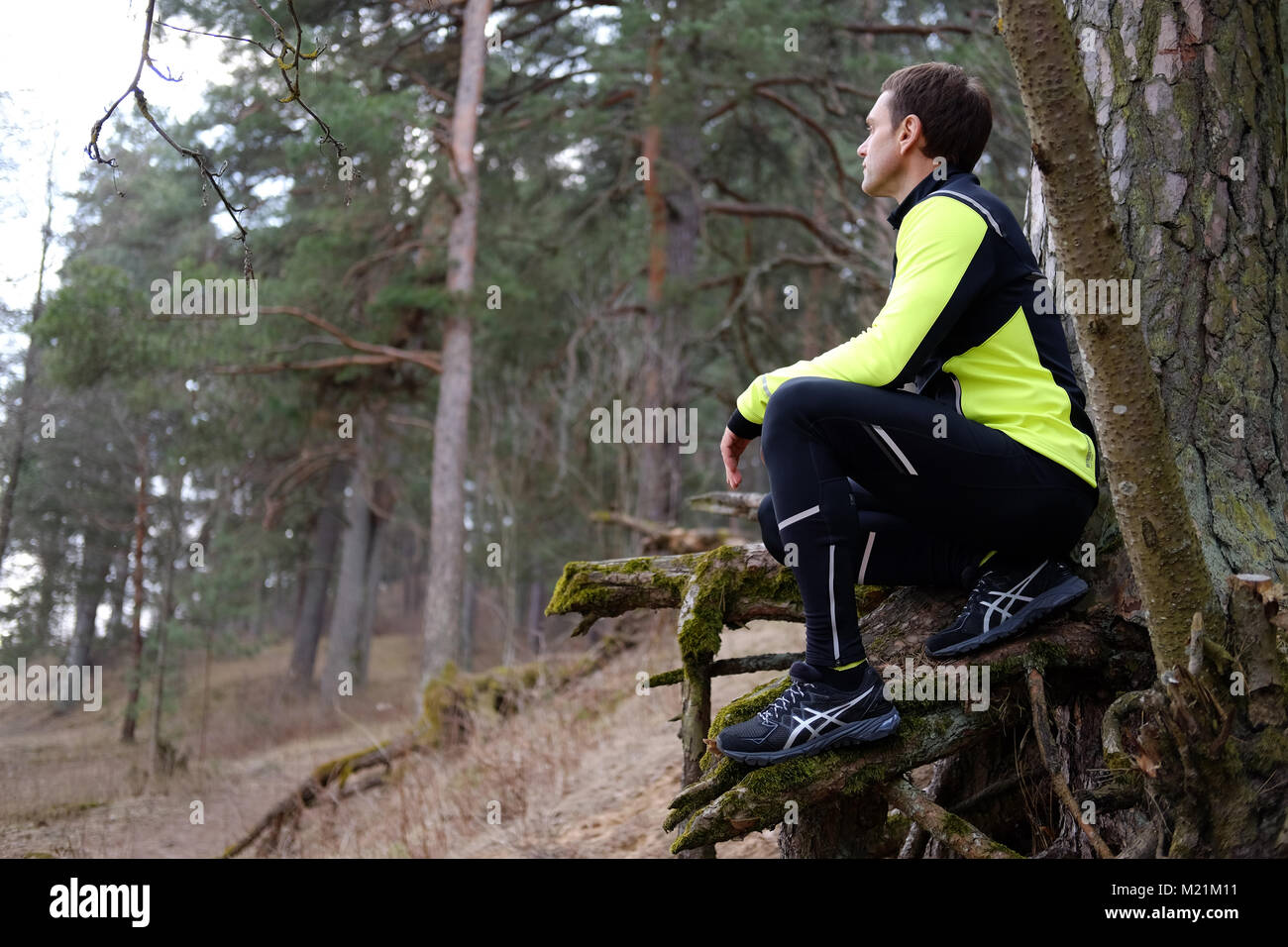 Sporty man in a forest Stock Photo - Alamy
