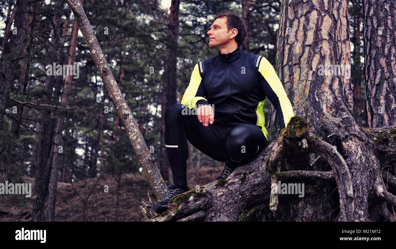 Sporty man in a forest Stock Photo - Alamy