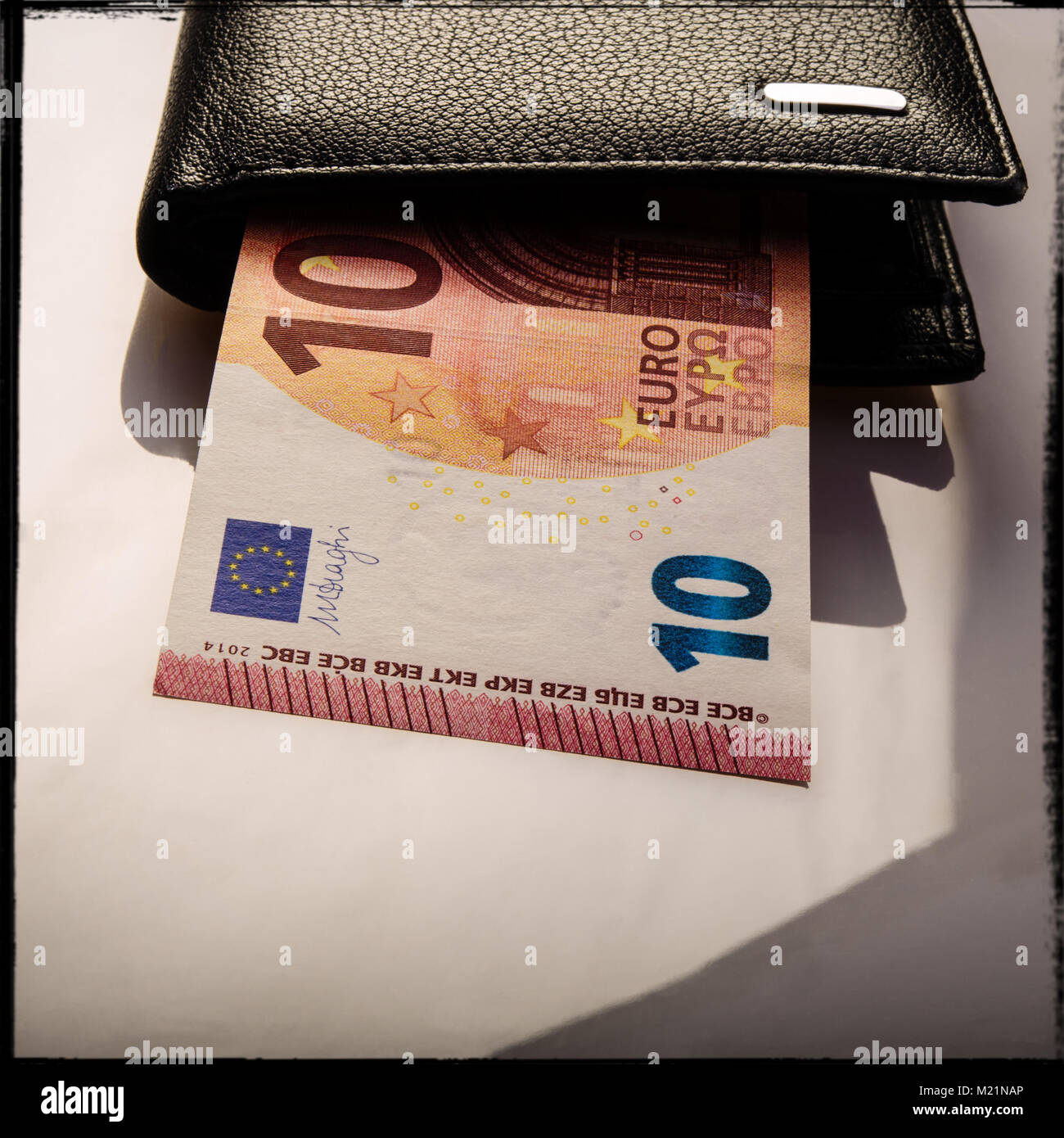 paper bill of ten euros and a wallet. Currency of the European Union ...