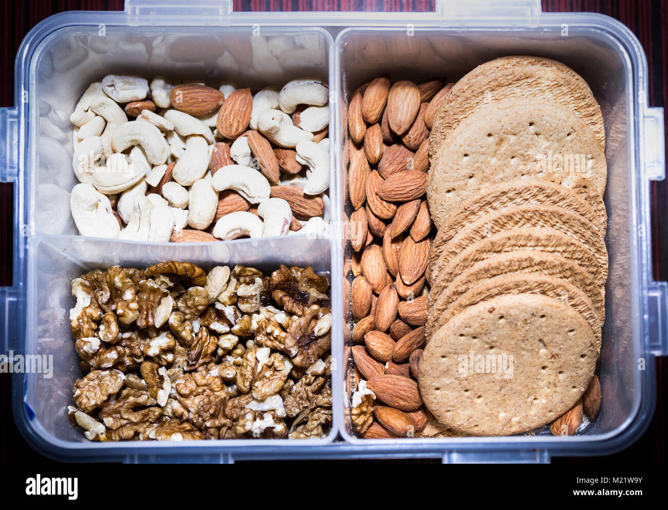Assorted nuts and biscuits on the Plastic box Stock Photo - Alamy