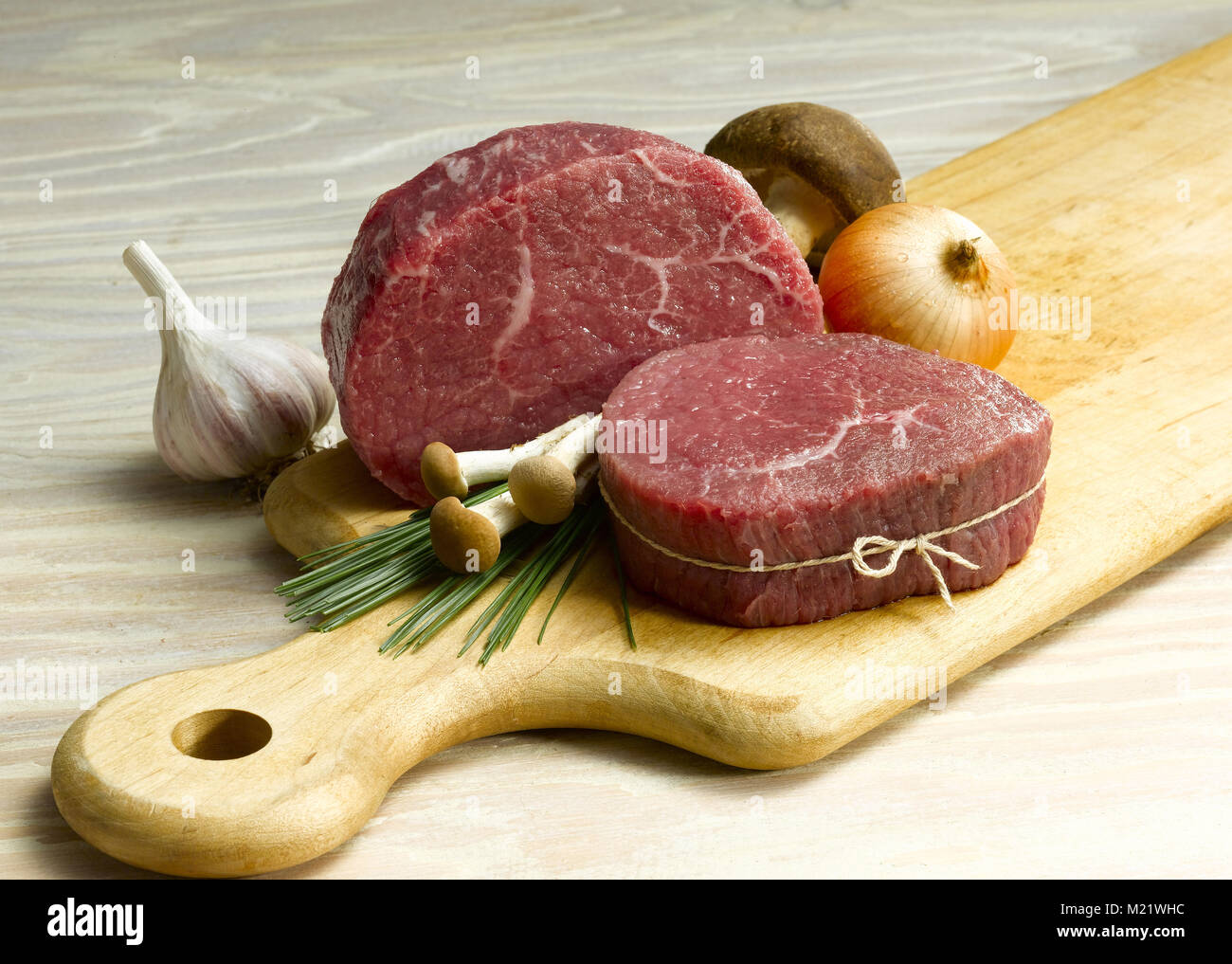 Raw beef on cutting board Stock Photo - Alamy