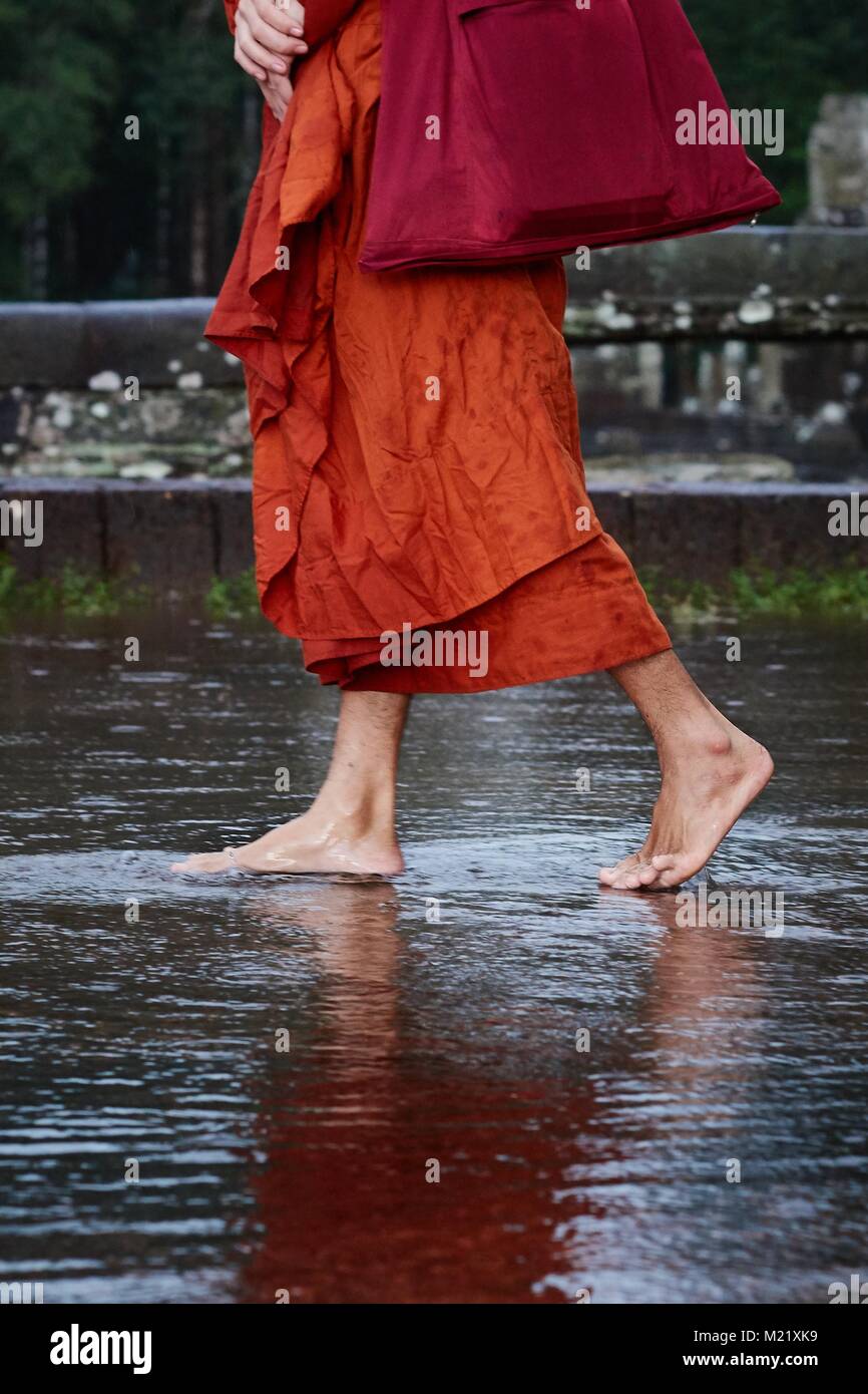 Buddhist monk walking on water, Angkor, Cambodia Stock Photo - Alamy