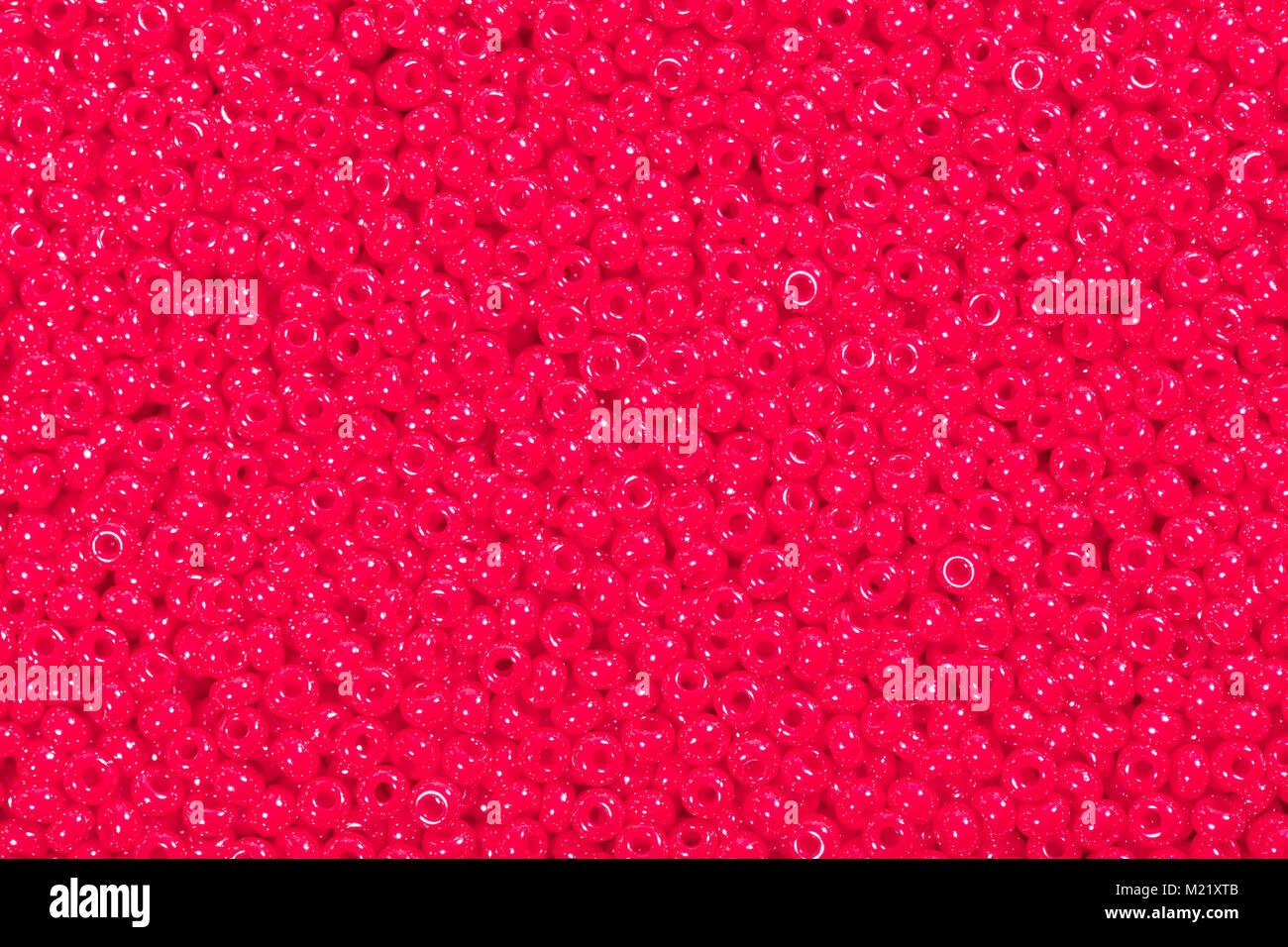 Seed beads of bright red color Stock Photo - Alamy